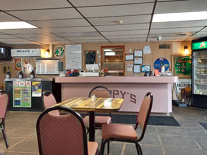 Step inside where nostalgia meets comfort. Pink chairs and wood tables create the perfect stage for the star attraction&mdash;food that makes memories. 