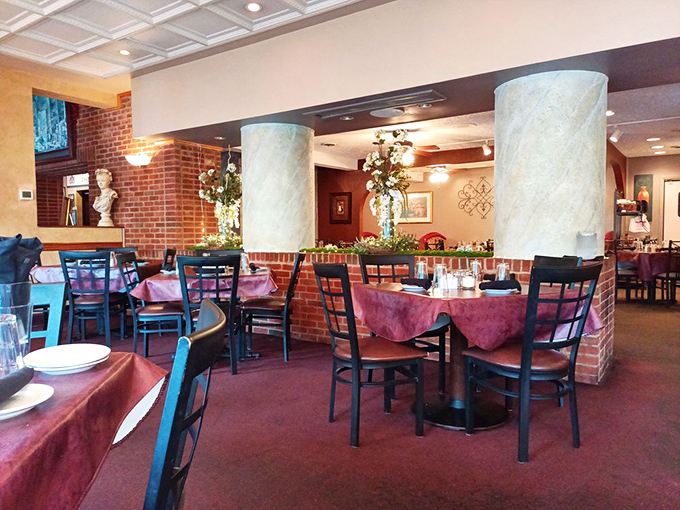 Inside, those burgundy tablecloths and exposed brick walls create the perfect backdrop for the impending pasta drama about to unfold on your plate.