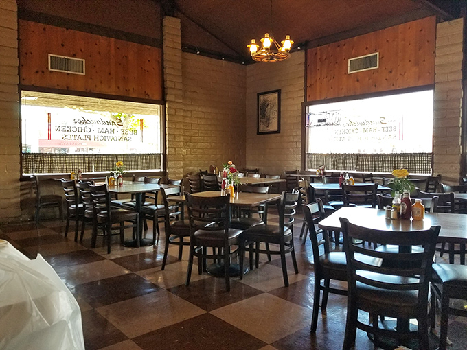 No designer chandeliers or fancy fixtures here&mdash;just honest wooden tables where barbecue dreams come true. The checkered floor has witnessed decades of sauce-stained smiles.