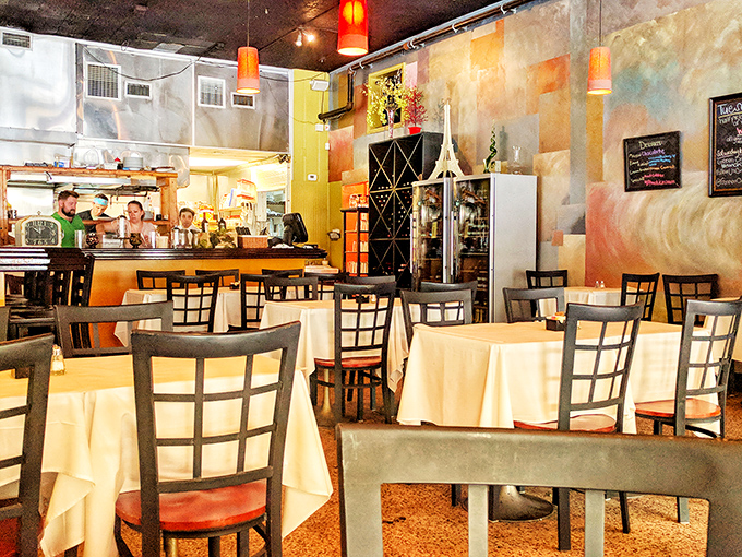 Inside, watercolor-washed walls and white tablecloths create that perfect sweet spot between "fancy enough for an anniversary" and "comfortable enough for Tuesday lunch."