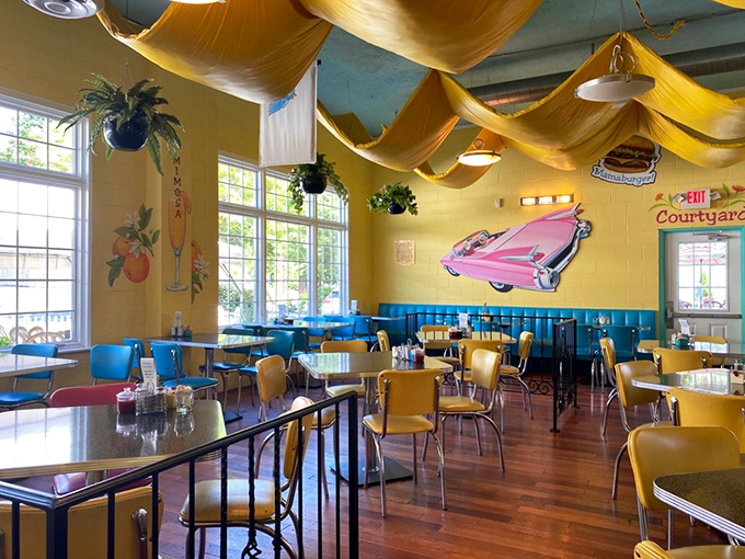 Imagine having breakfast inside a summer sunset. Yellow fabric draped from the ceiling creates a warm glow that makes everyone look like they slept well.
