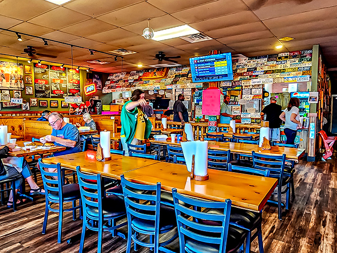 Inside, every inch tells a story&mdash;from license plates to memorabilia&mdash;while blue chairs and wooden tables stand ready for the serious business of barbecue.