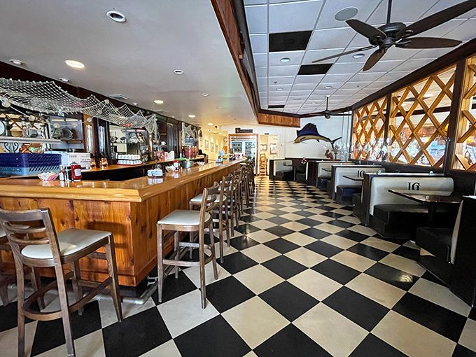 The classic black-and-white checkered floor and warm wooden counter create that perfect "you've arrived" feeling. Comfort begins before you even eat.