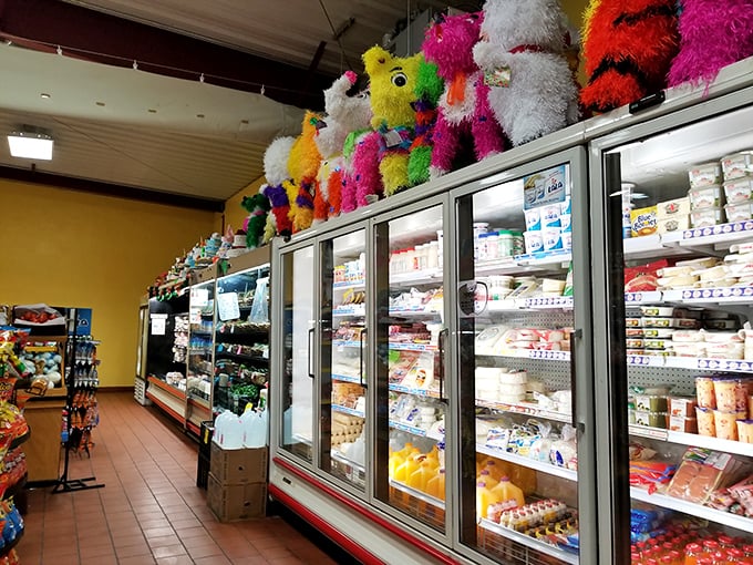 Pi&ntilde;atas watch over a wonderland of Mexican groceries, like festive guardians ensuring your pantry will never be boring again.