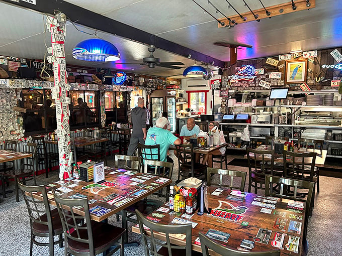 Dollar bills and memorabilia create a tapestry of memories on every surface. This isn't d&eacute;cor&mdash;it's a living museum of good times.