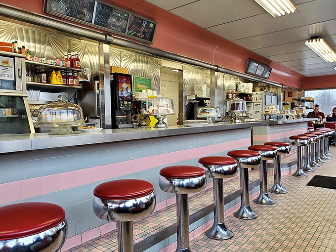 Classic counter seating where friendships are forged over coffee refills. Those red vinyl stools have witnessed more heart-to-hearts than most therapists.