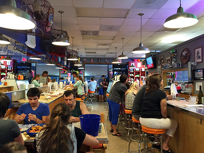 Inside, controlled chaos reigns as diners crack, peel, and savor their way through oceanic treasures. Note the fishing nets overhead &ndash; not just d&eacute;cor.