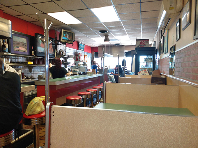 Inside, the classic diner setup with red accents and counter seating creates that perfect "I've found somewhere special" feeling that food adventurers live for.