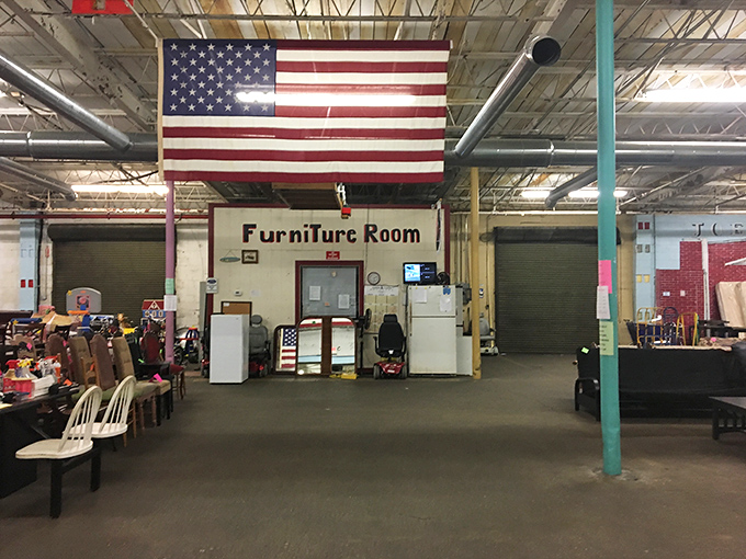 The furniture room stands proudly under Old Glory, where sofas and chairs wait patiently for their second chance at cradling someone's behind.