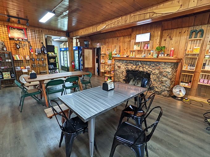 Rustic wood-paneled walls and a stone fireplace create that "grandpa's cabin meets gourmet hideaway" vibe that makes you want to linger all afternoon. 