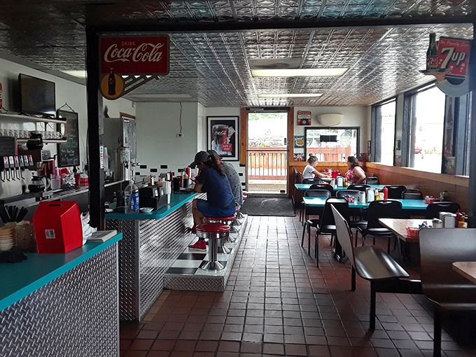 Classic diner perfection with its pressed tin ceiling, counter seating, and that unmistakable buzz of breakfast conversations in progress.