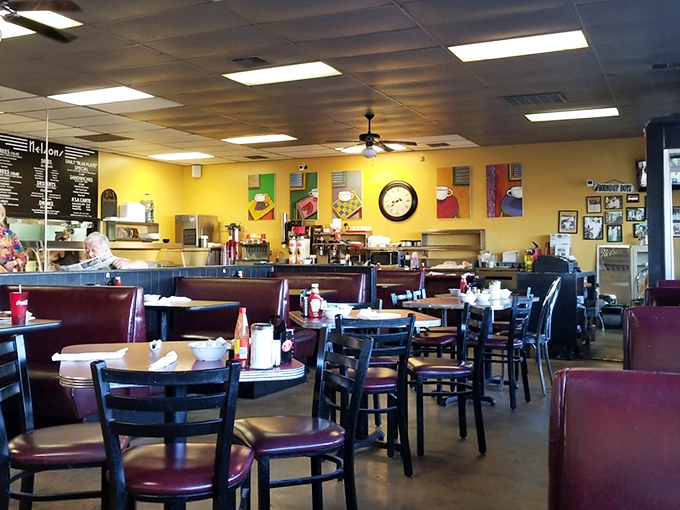 Sunshine-yellow walls and cozy booths create the perfect backdrop for comfort food conversations. Nelson's dining room feels like coming home.