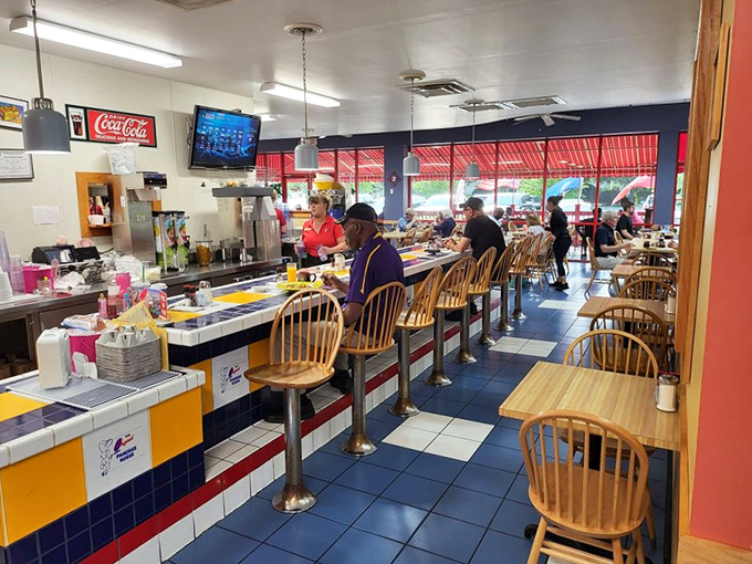 Counter culture at its finest. The blue and yellow tiled counter offers front-row seats to the breakfast symphony conducted by veteran griddle maestros.