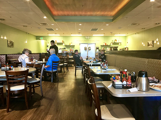 The mint-green walls and comfortable booths create that rare atmosphere where both early birds and those dragging themselves to breakfast feel equally at home.