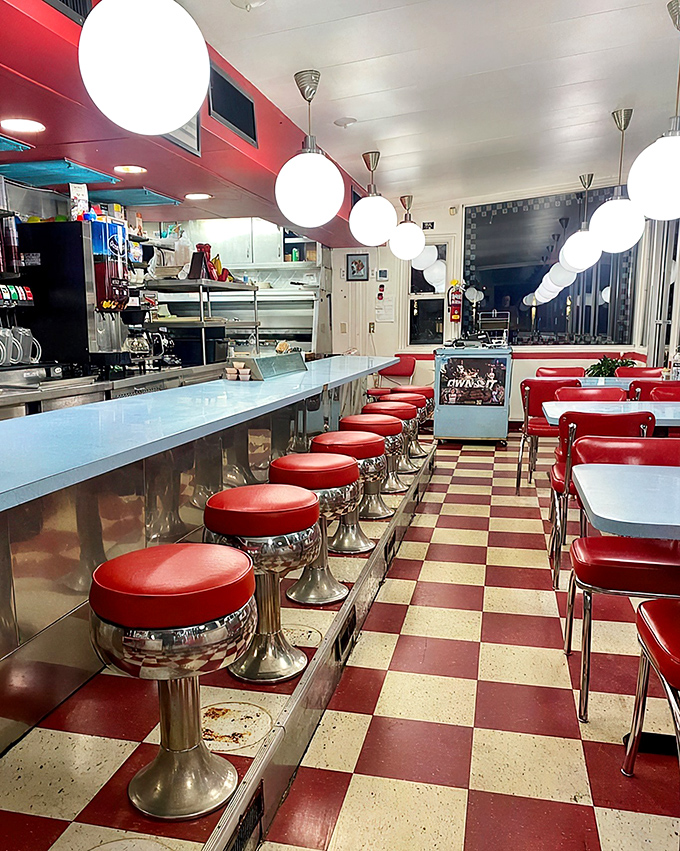 Red vinyl stools lined up like patient soldiers, ready for the morning rush. This counter has heard more Columbia stories than a bartender on graduation weekend.