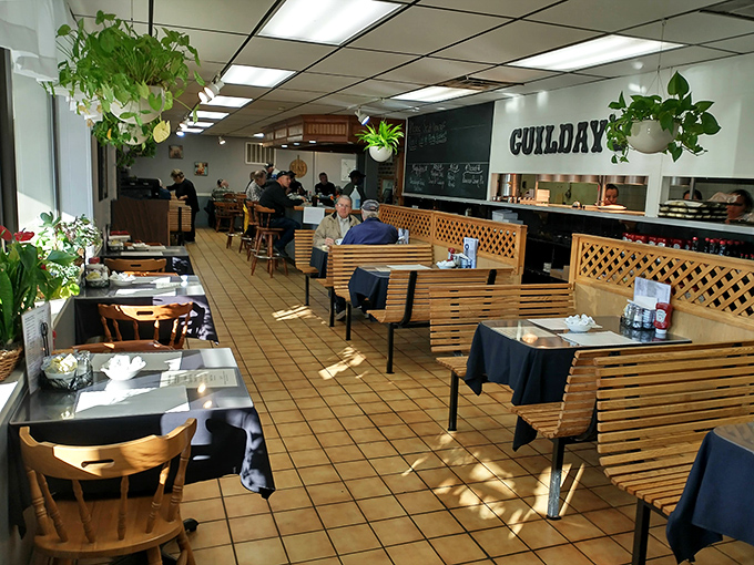 Inside, wooden booths and hanging plants create that perfect diner atmosphere where breakfast dreams come true and coffee cups never empty.