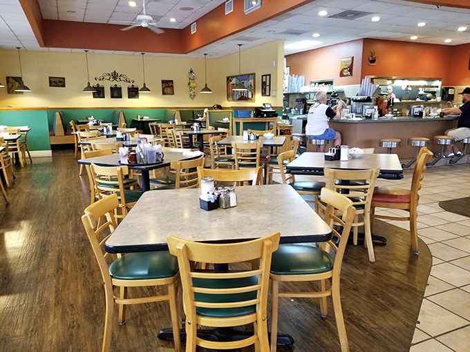 Classic diner comfort meets Florida casual inside Rodie's, where wooden chairs, warm colors, and an open kitchen create the perfect backdrop for breakfast bliss.