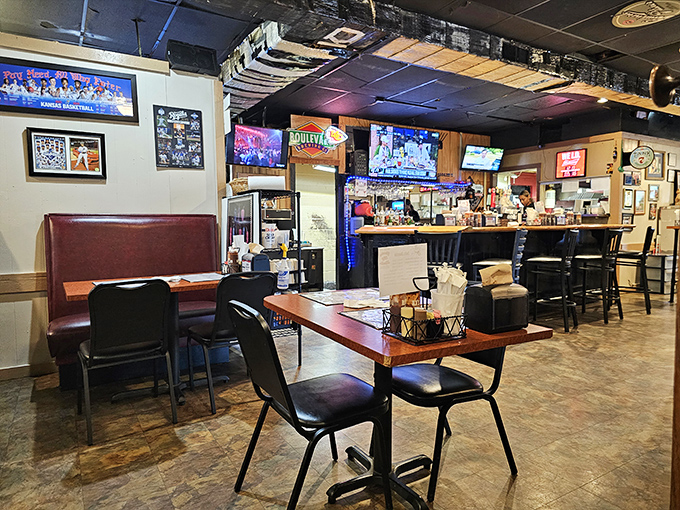 Where barbecue dreams come true: Red vinyl booths, sports on TV, and the promise of smoky delights just beyond that kitchen door.