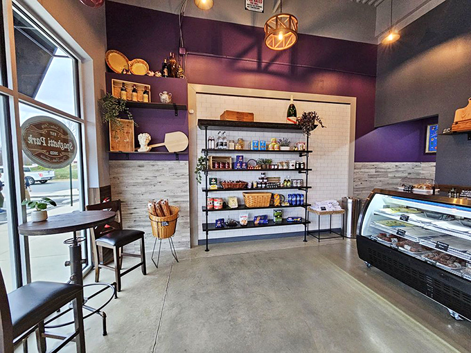 Purple walls and rustic shelving create the perfect backdrop for pasta dreams. Here, ambiance meets authenticity without trying too hard.