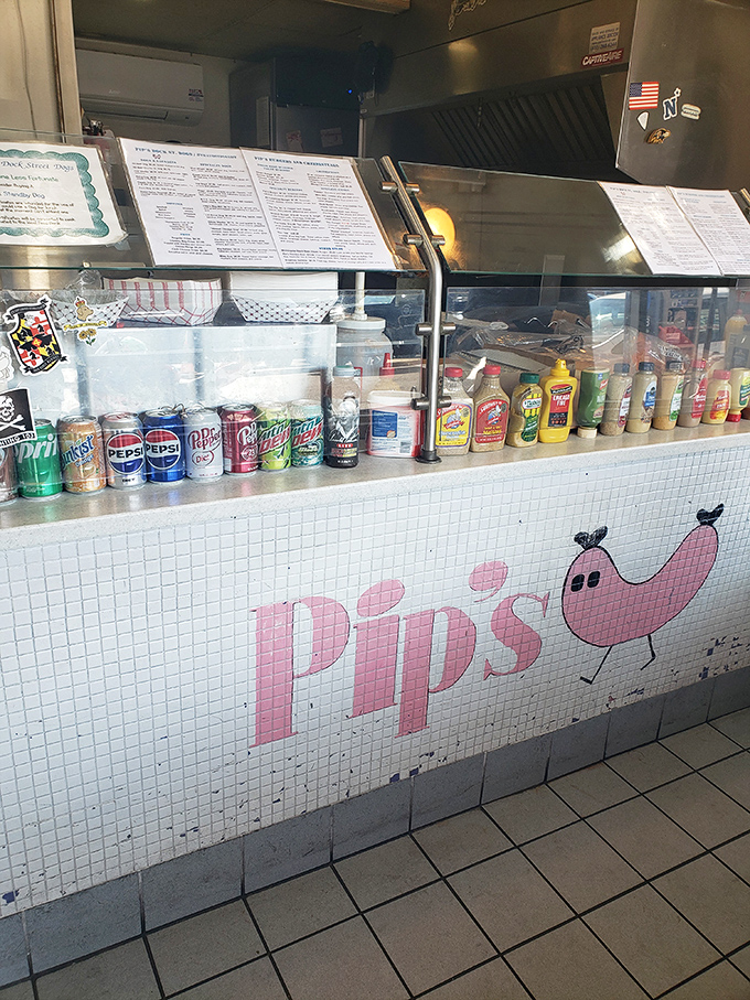 That playful pink hot dog mascot says everything you need to know about Pip's philosophy: life's too short for boring fast food.