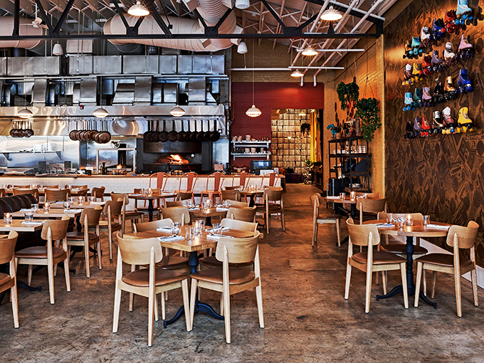 Industrial charm meets Southern comfort in this thoughtfully designed space. The open kitchen isn't showing off—it's showing you exactly what you're in for.