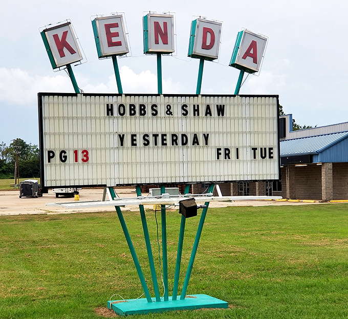 The iconic Kenda marquee stands tall against the Arkansas sky, a neon beacon announcing tonight's double feature to eager moviegoers.