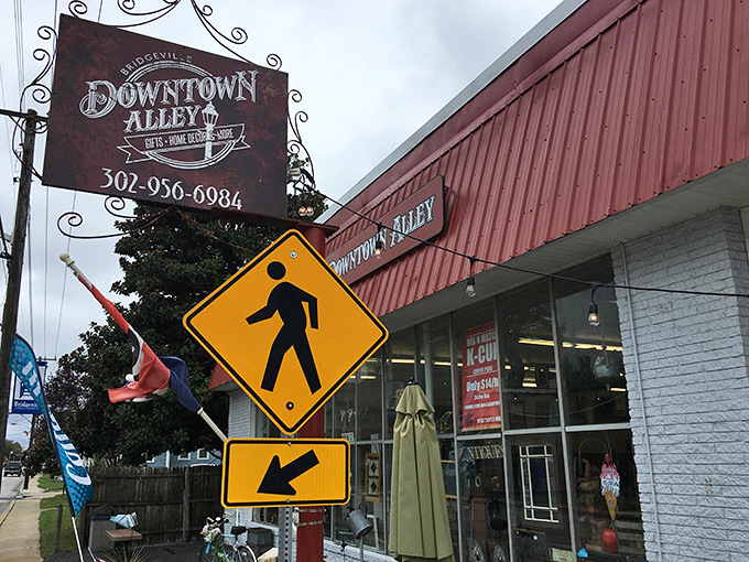 The vintage sign beckons like an old friend, while the pedestrian crossing sign below might as well say "Cross here to enter another dimension of shopping."