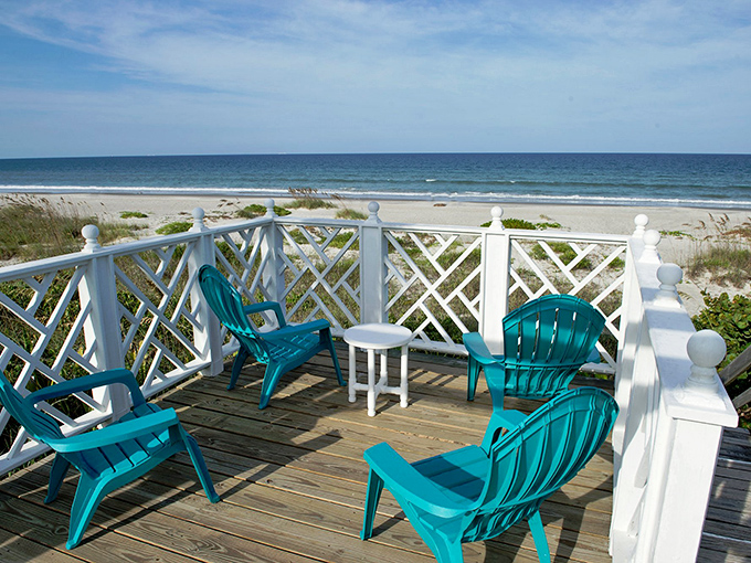 Paradise found: Turquoise Adirondack chairs on the oceanfront deck create the perfect perch for sunrise coffee, sunset cocktails, or midday dolphin-spotting sessions.