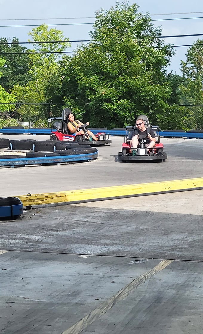Racing nirvana! Two competitors navigate the track with that perfect blend of concentration and joy that only go-karts can inspire.