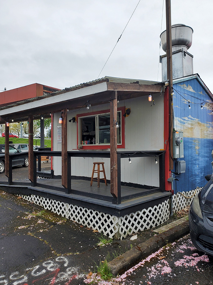 Red umbrellas and picnic tables create an unpretentious dining area where strangers become friends united by their quest for perfect fried chicken.