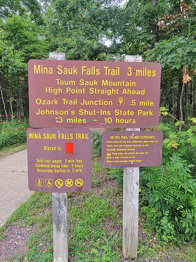 Trail signs: where expectations meet reality. Three miles might not sound like much until you're halfway up what feels like Missouri's version of Kilimanjaro.