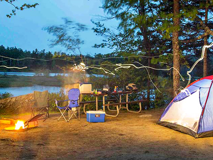 Camping nirvana: string lights, crackling campfire, and that tent-with-a-view. Just add marshmallows and ghost stories for the complete New Hampshire experience.