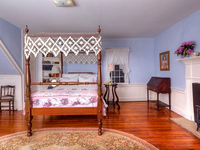 Four-poster perfection in the Blue Room, where that handcrafted lace canopy has witnessed more peaceful slumbers than a lullaby composer.