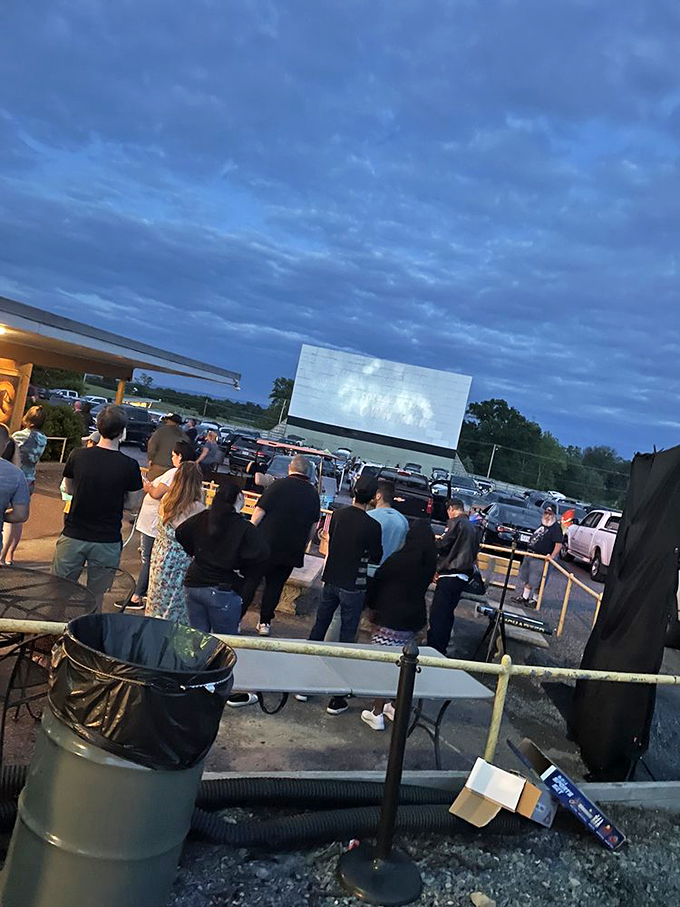 The pre-show social hour: where strangers become neighbors united by the anticipation of cinematic adventures under open skies.