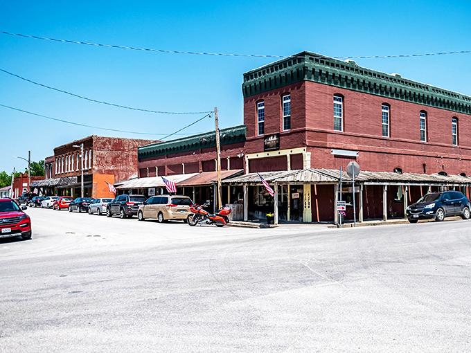 Historic brick buildings line Jamesport's main street, their weathered facades telling stories of railroad boom days and rural American resilience.