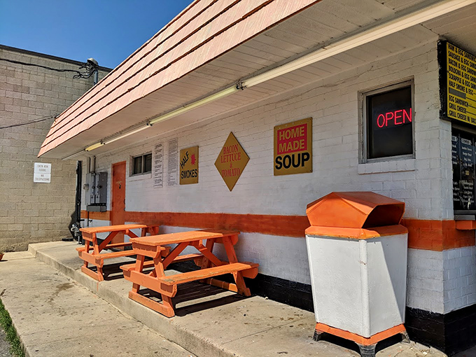 Orange picnic tables invite you to enjoy your meal al fresco, while the "HOME MADE SOUP" sign promises comfort in any season.