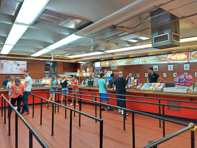 The concession stand hustle&mdash;where movie night memories begin with the ceremonial exchange of cash for calories that somehow taste better in the dark.