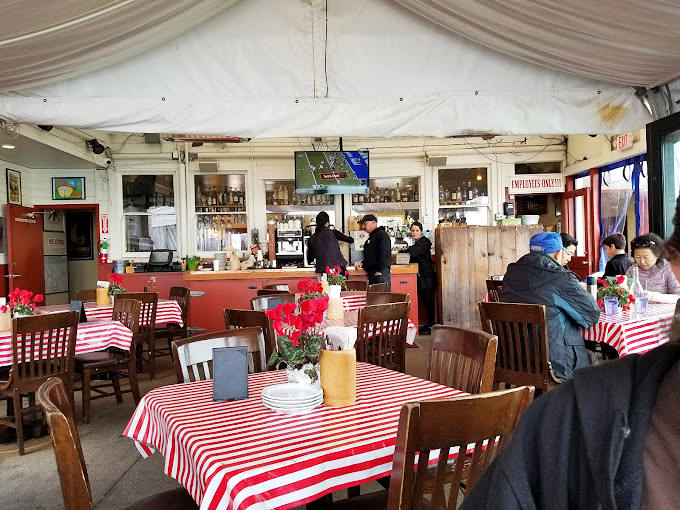 Red and white checkered tablecloths aren't just nostalgia&mdash;they're an invitation to roll up your sleeves and get serious about seafood. No pretension, just delicious intention.