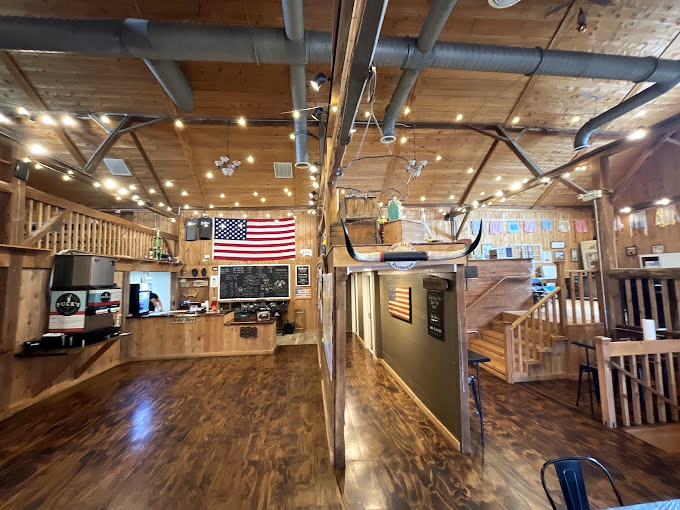 A cozy corner where checkers and conversation flow as freely as the barbecue sauce. This wooden haven proves good things happen in simple spaces.