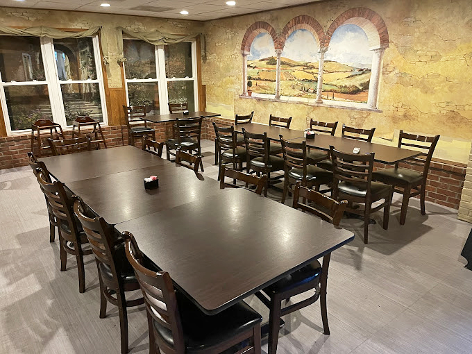 Italian countryside murals transport diners beyond Delaware while wooden tables invite lingering conversations between bites of sandwich perfection.