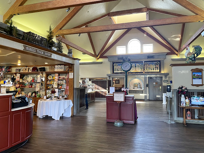 Soaring wooden beams create a country cathedral effect inside, where the gift shop tempts you before the main event. Like Disneyland's Main Street for hungry adults.