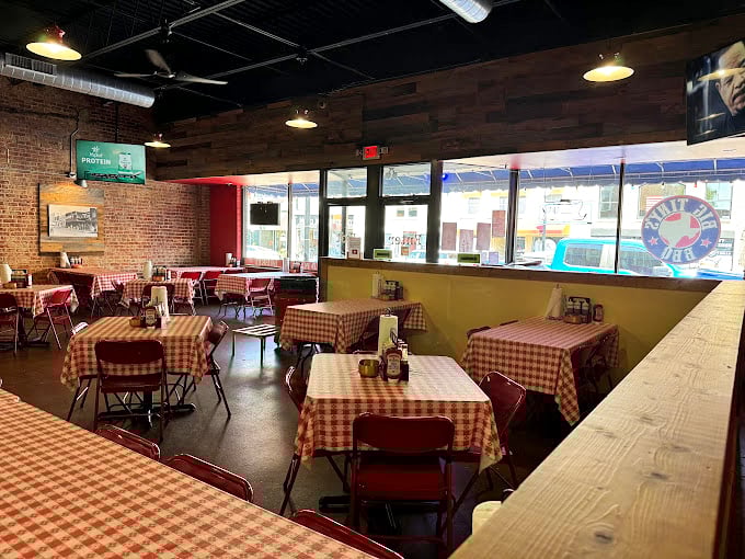 Red-checkered tablecloths: the universal signal that you're about to eat something honest and delicious. No pretension here, just the promise of barbecue bliss in a brick-walled sanctuary.