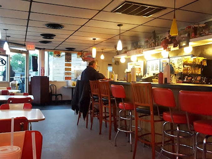Red vinyl counter stools await the faithful at Leon's, where the counter service isn't just efficient&mdash;it's front-row seating to a barbecue masterclass.