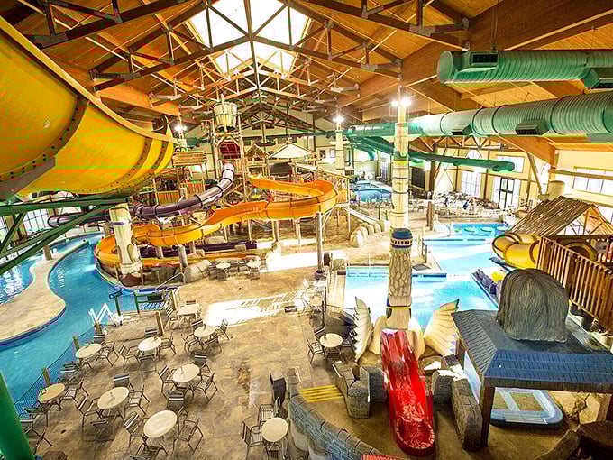 Architectural marvel meets splash zone. The soaring wooden beams frame a playground of colorful tubes that would make any adult temporarily forget their mortgage payments.