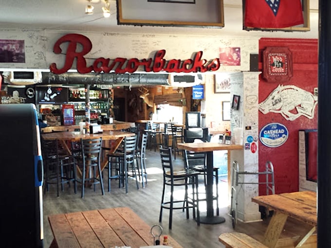 Arkansas Razorbacks pride meets seafood sanctuary in this wood-paneled interior where every wall tells a story and every table holds a promise.