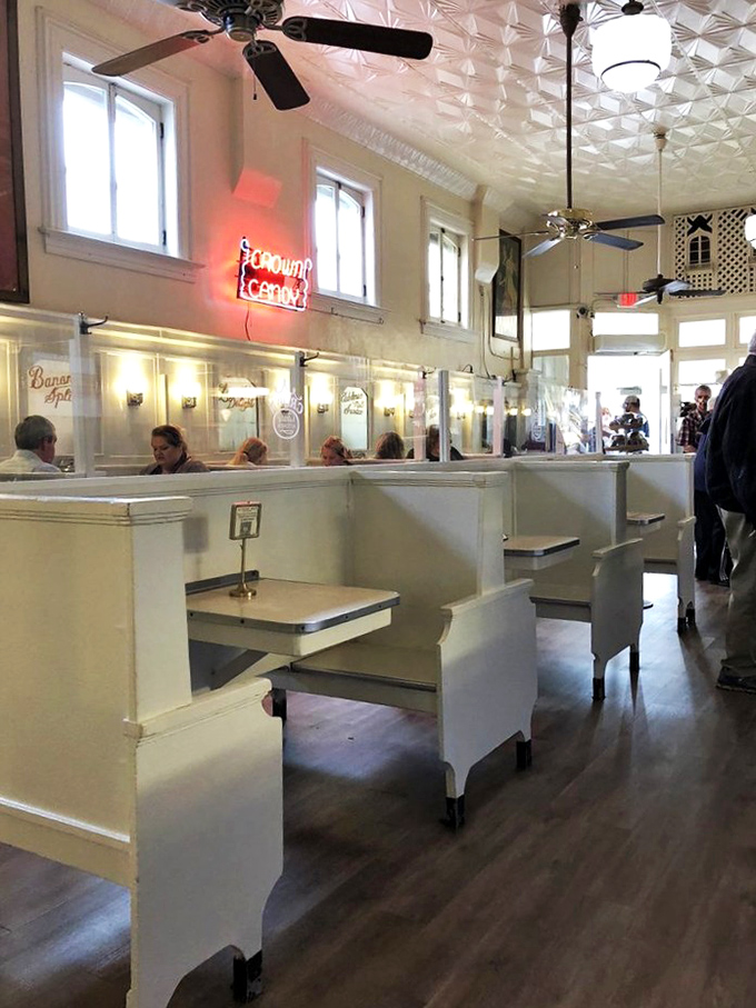 Step inside and suddenly you're in 1913&mdash;white booths, vintage ceiling, and the promise of comfort food that predates modern cholesterol concerns.