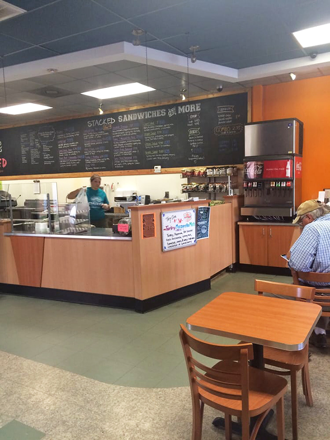 Simplicity reigns in this no-nonsense interior where orange accents add warmth. The chalkboard menu &ndash; a canvas of possibility for hungry patrons.