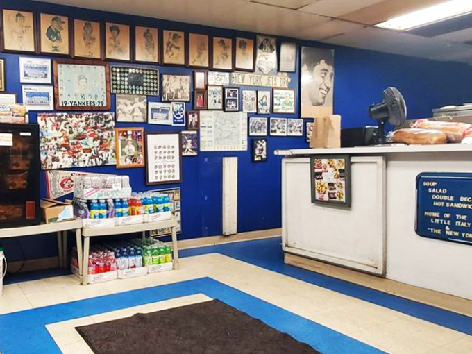 Baseball legends watch over your lunch from blue walls that have witnessed more sandwich satisfaction than a major league dugout sees home runs.