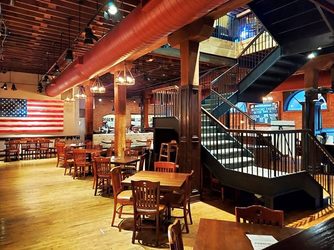 Step inside and the magic reveals itself: exposed brick, wooden beams, and that staircase that practically begs you to explore what's upstairs.