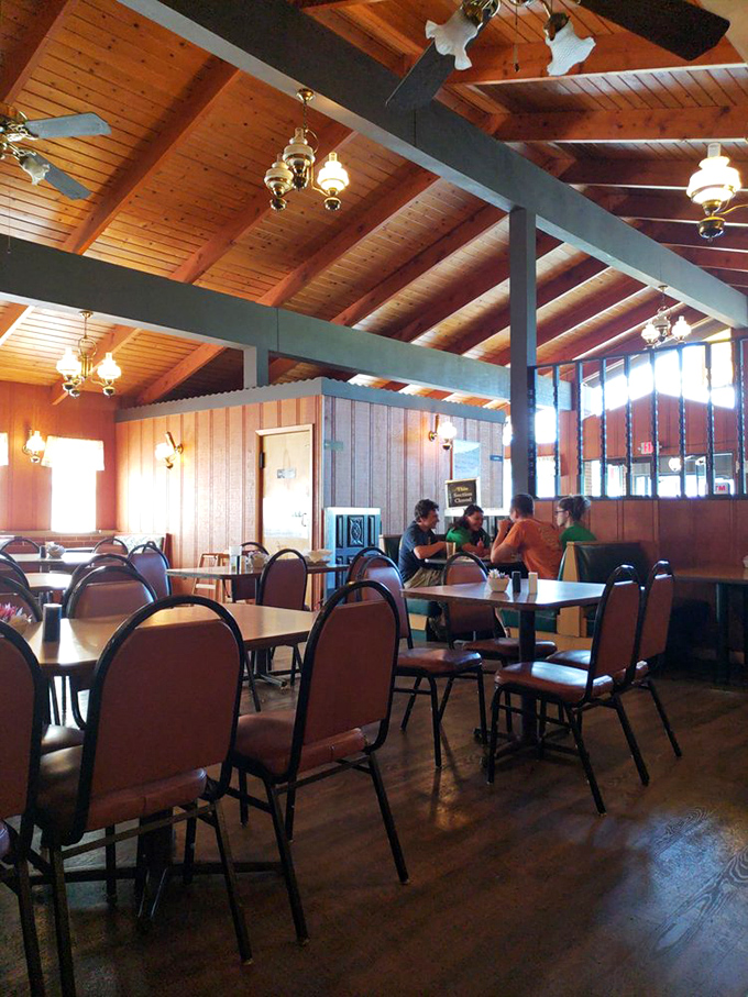 Warm wood paneling, vintage lighting, and comfortable seating create the perfect backdrop for breakfast magic. This isn't designer rustic&mdash;it's the real deal.